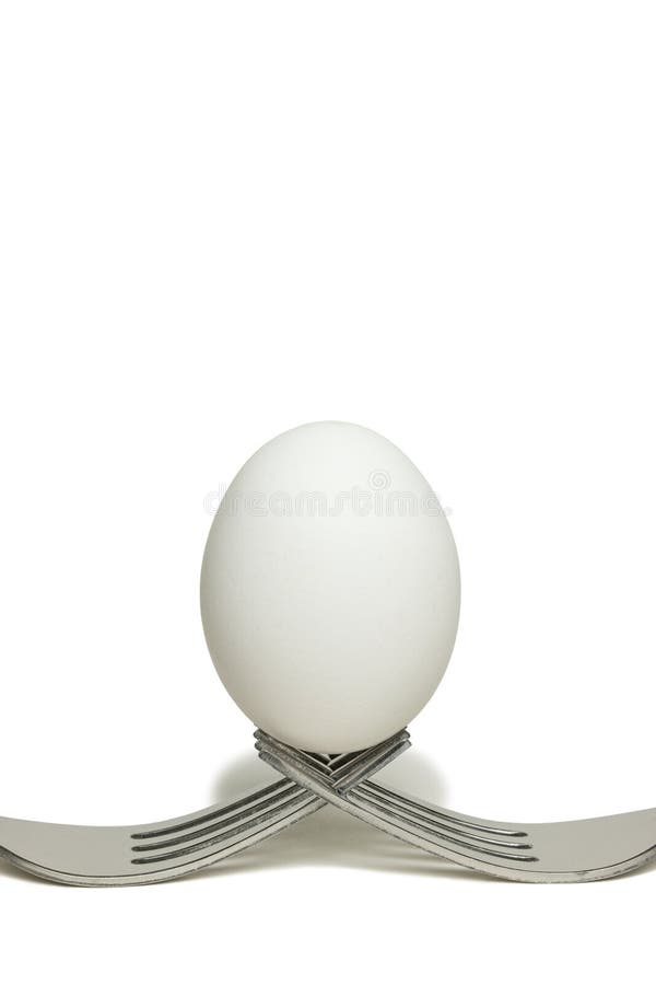 Egg Balanced on Two Forks stock image. Image of food - 265872619