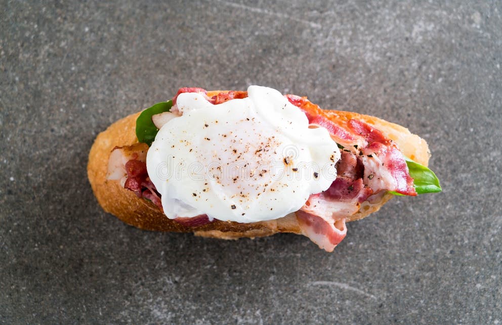 Egg Benedict with Bacon and Rocket Stock Photo - Image of meal ...