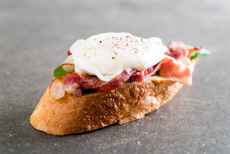 Egg Benedict with Bacon and Rocket Stock Photo - Image of benedict ...