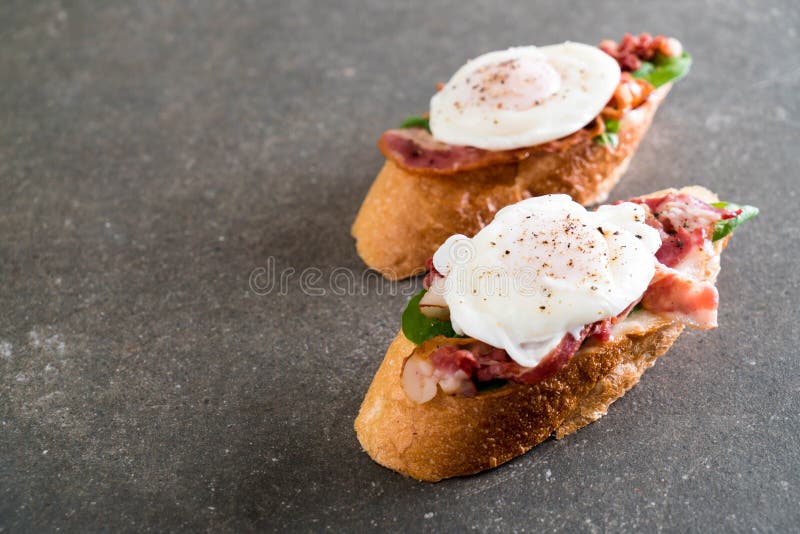 Egg Benedict with Bacon and Rocket Stock Image - Image of eggs ...