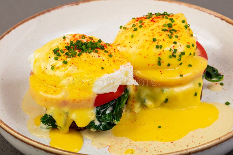 Egg Benedict with cheese stock photo. Image of lunch - 128066980