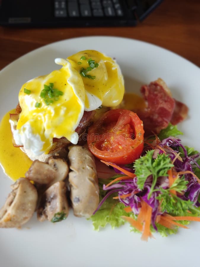 Egg benedict with sausage stock image. Image of fruit - 264234813