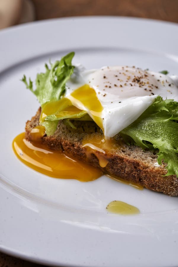 Egg benedict on a toast stock photo. Image of breakfast - 189959772