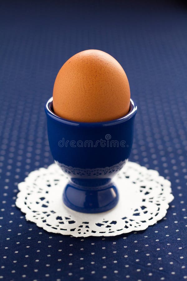 An Egg on a Blue Background Stock Image - Image of food, white: 26973889