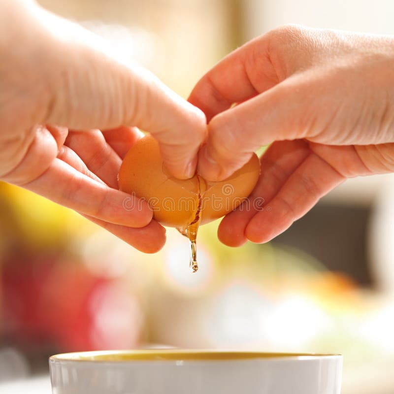 Egg cracking stock photo. Image of crack, yolk, female - 13831056