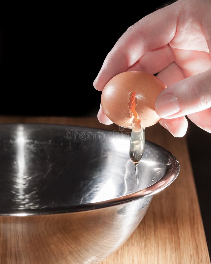 Egg Cracking stock photo. Image of baking, mixing, protein - 52682220