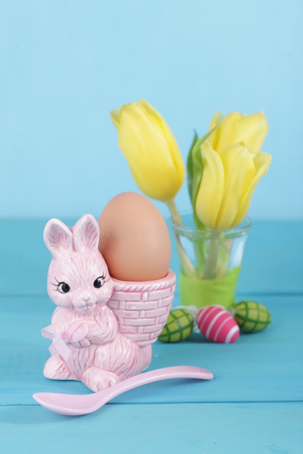 Egg cups with easter bunny stock image. Image of celebration - 89329375