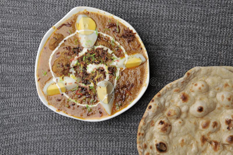 Egg curry served with roti stock image. Image of leaves - 192774961