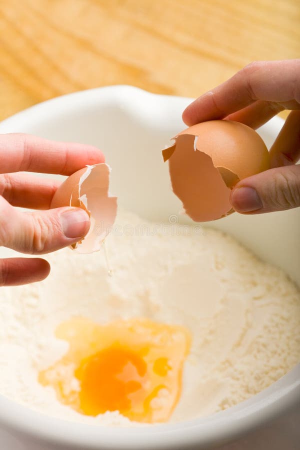 Egg in dough mixture stock photo. Image of recipe, bowl - 19645818