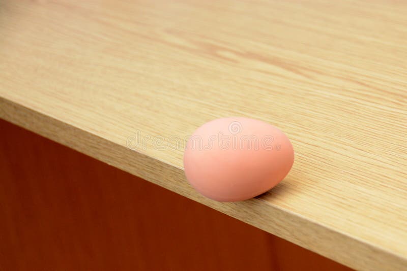 Egg on the Edge of the Table Stock Image - Image of rolls, single ...