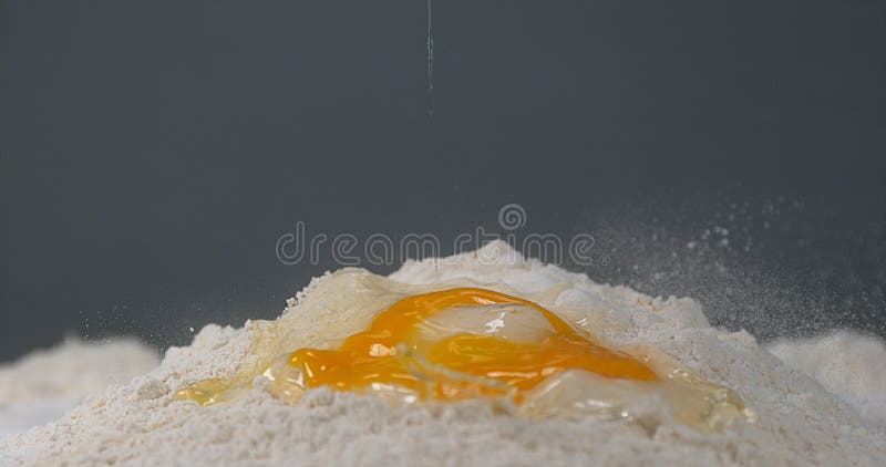 Egg Falling on Flour stock image. Image of life, motion - 289193227