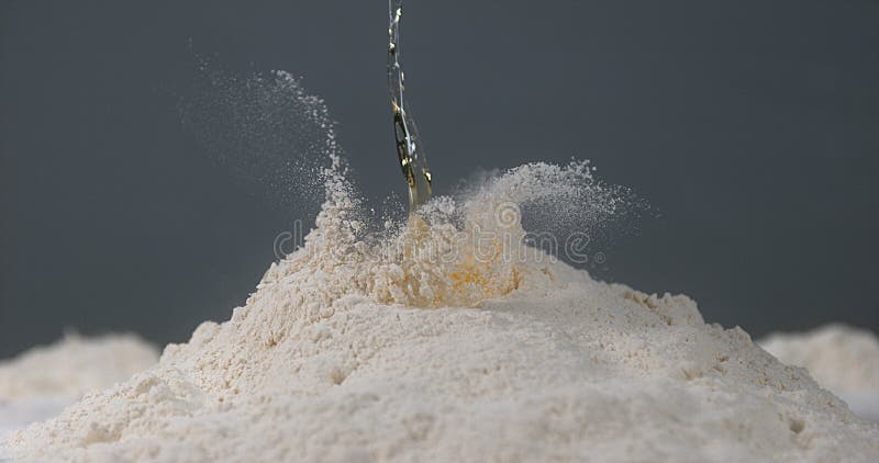 Egg Falling on Flour stock photo. Image of food, life - 289193240