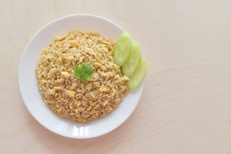 Egg Fried Rice with Cucumber on a White Plate. Stock Photo - Image of ...