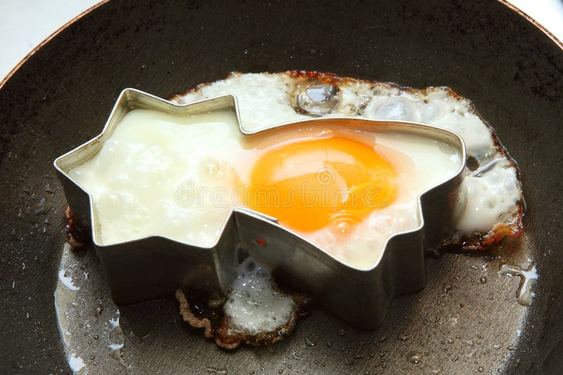 Egg frying in star shape stock image. Image of appetising - 10050321