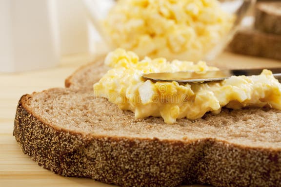 Egg Mayonnaise Being Spread on Bread Stock Photo - Image of closeup ...