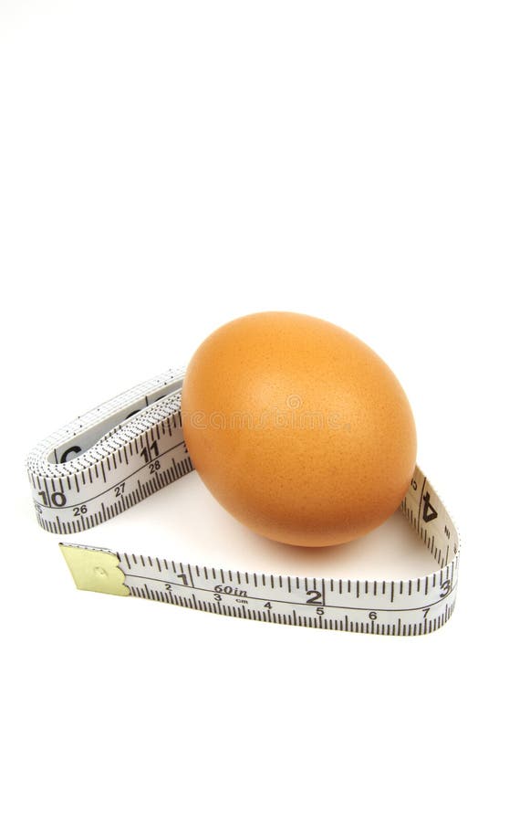 Egg and measuring tape stock photo. Image of measurement - 28706402
