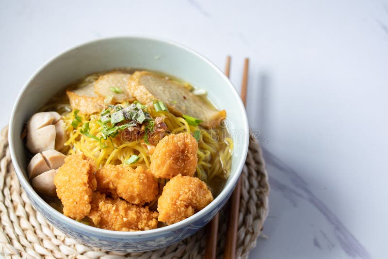 Egg Noodles and Fried Chicken with Fish Balls in Cups Stock Photo ...
