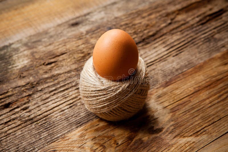 Egg in rope coil on old stock photo. Image of cooking - 39354336