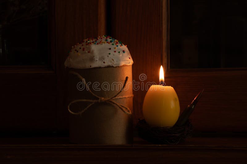 Egg-shaped Candle and Bullet and Next To it Stands an Easter Cake on a ...