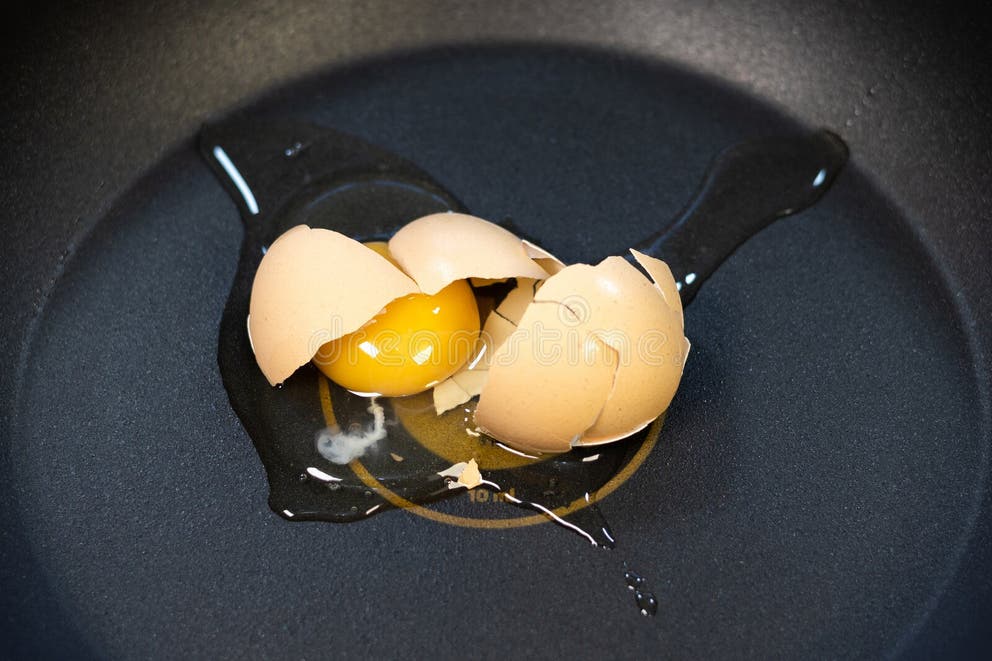 Egg with Shell Broken on Frying Pan. Close Up, Failed Cooking Stock ...