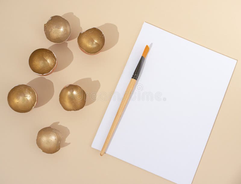 Egg Shells Painted in Gold on the Inside on a Light Sand-colored ...