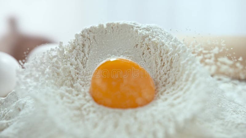 Egg Yolk Falling and Rolling Down the Pile of White Flour in 1000 FPS ...