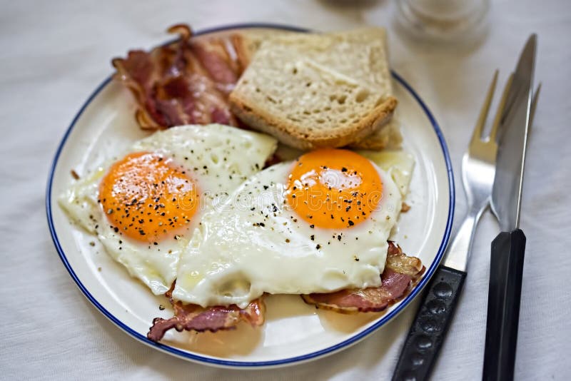 Eggs on bacon with bread stock photo. Image of morning - 88702020