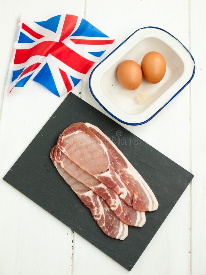 Bacon and Eggs with Cup of Tea, Toast and British Flag Behind Stock ...
