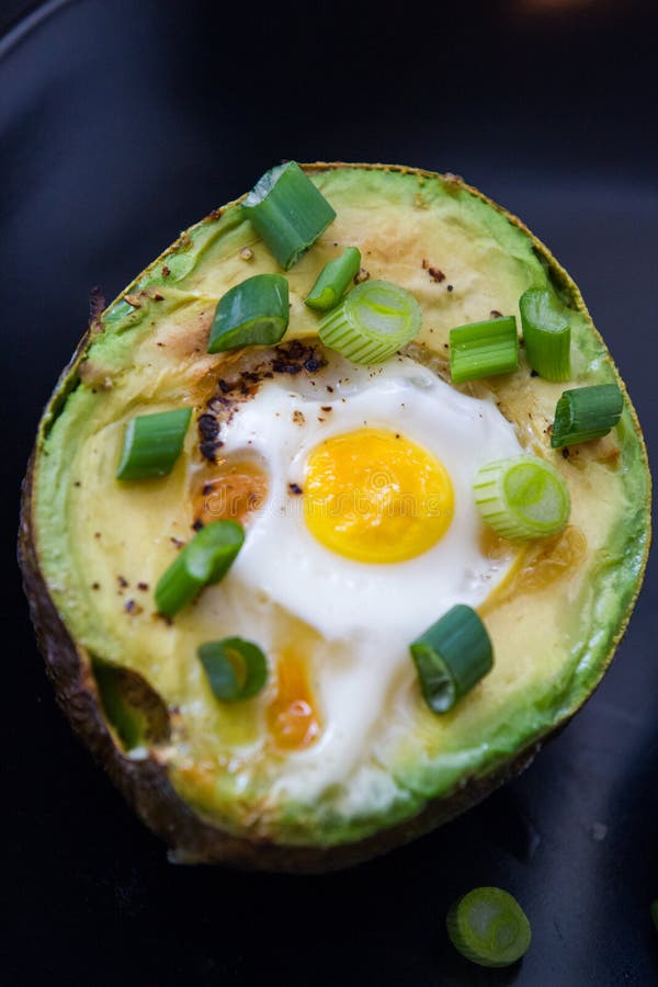 Baked eggs in avocado stock image. Image of closeup, dish - 49386319