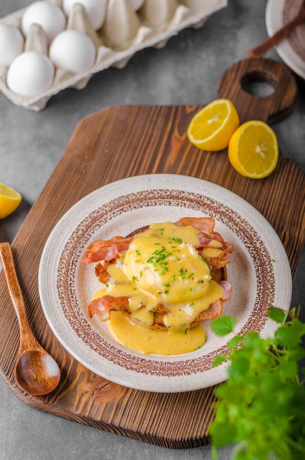 Eggs benedict with bacon stock image. Image of bacon - 91543057