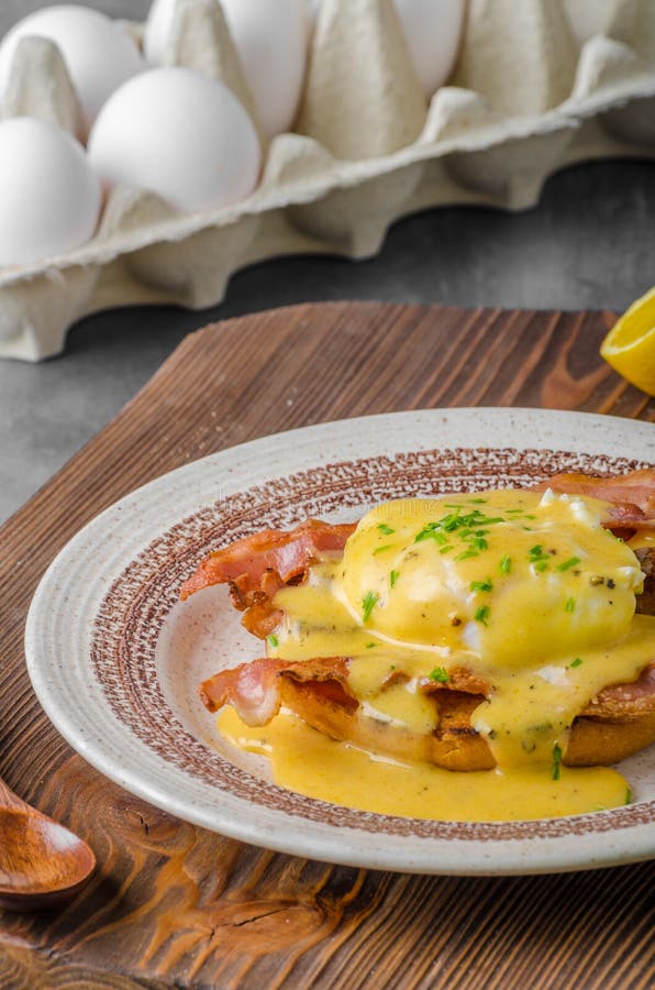 Eggs benedict with bacon stock photo. Image of fork, salad - 91886506