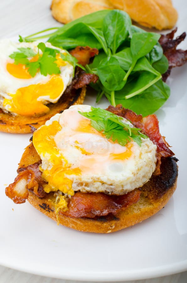 Eggs Benedict with Bacon and Spinach Stock Image - Image of muffin ...