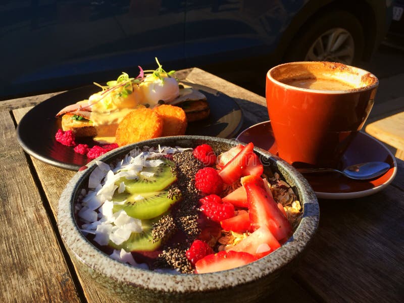 Eggs Benedict and Fruit Meal Stock Photo - Image of fruit, mandarin ...