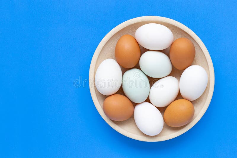 Eggs on blue background stock image. Image of diet, healthy - 155480699