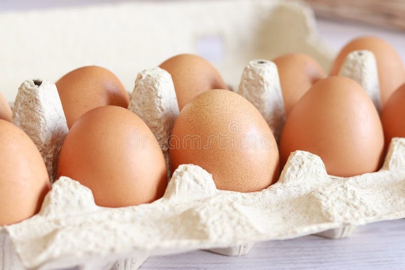 Eggs in a Cardboard Box. Fresh Raw Eggs in a Paper Egg Container Stock ...