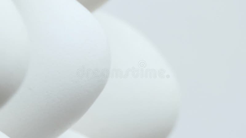 Vertical Screen: Eggs in a Carton, Spinning White Chicken Eggs in a ...