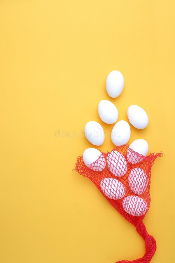 Eggs,Eggs Come Out of the Net Red Bag.top View Yellow Background Easter ...