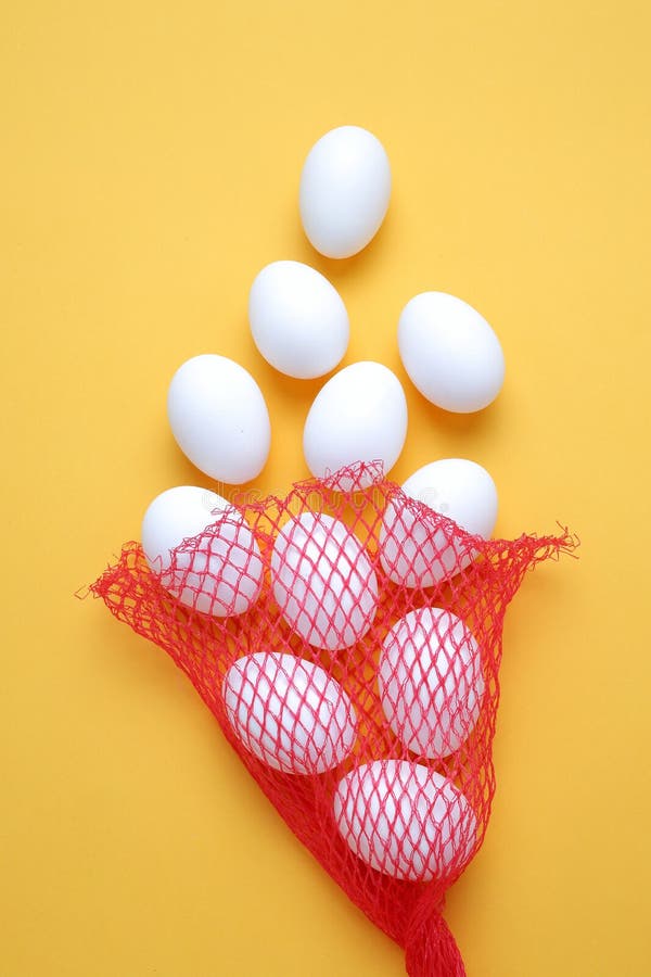 Eggs,Eggs Come Out of the Net Red Bag.top View Yellow Background Easter ...