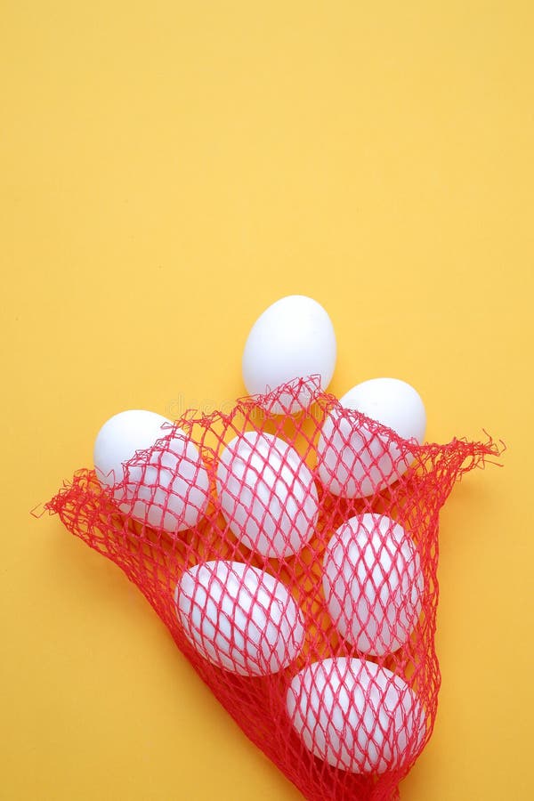 Eggs,Eggs Come Out of the Net Red Bag.top View Yellow Background Easter ...