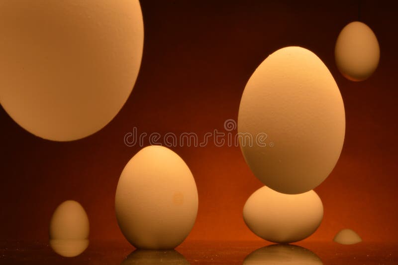 Eggs Floating Upward from Table Surface Stock Photo - Image of ascend ...