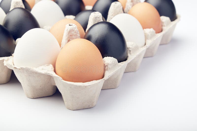 Eggs of Different Colors in Boxes. Black, White and Brown Chicken Eggs ...