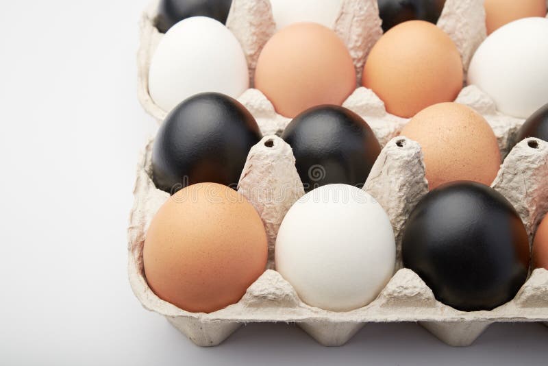 Eggs of Different Colors in Boxes. Black, White and Brown Chicken Eggs ...