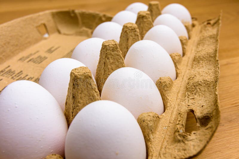 Eggs in egg carton stock photo. Image of breakfast, farm - 302800418
