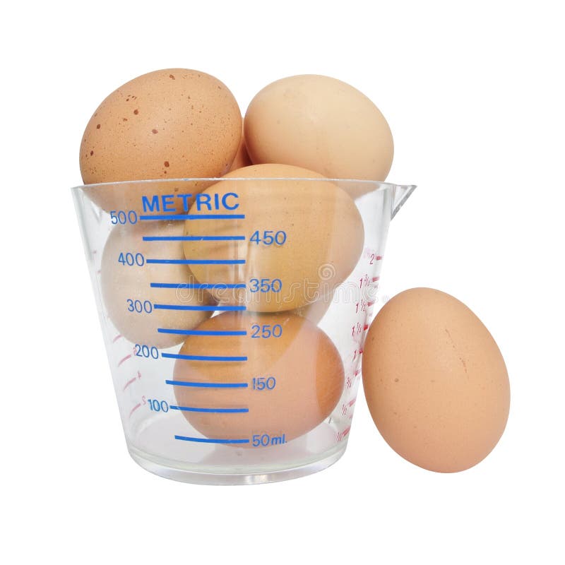 Eggs in measuring cup stock photo. Image of group, food - 53772564