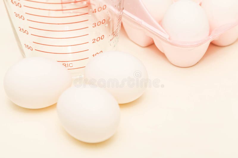 Eggs and Measuring Cup stock image. Image of groceries - 50644135