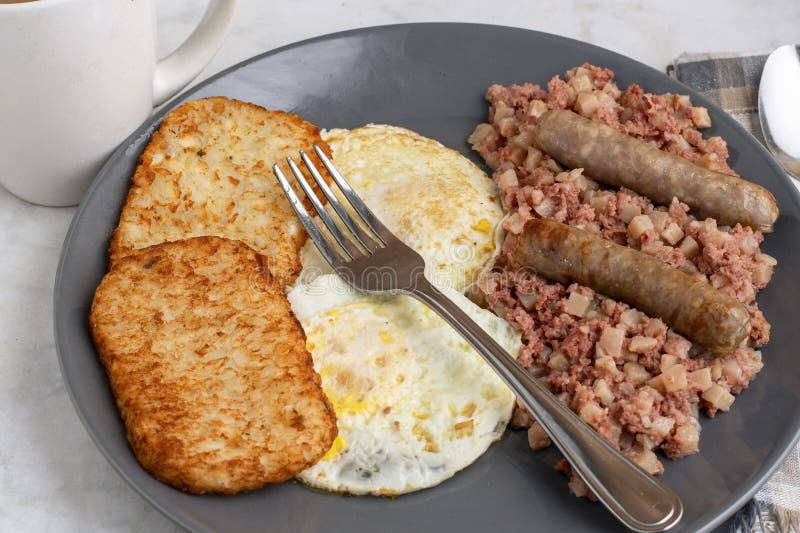 Eggs Ove Easy with Corn Beef Hash and Sausage Stock Image - Image of ...