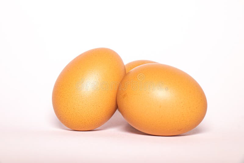 Eggs on a white background stock photo. Image of yellow - 231692380