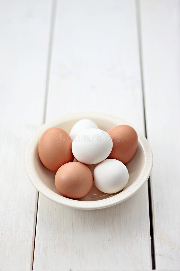 Eggs in withe bowl stock photo. Image of board, bright - 28939938