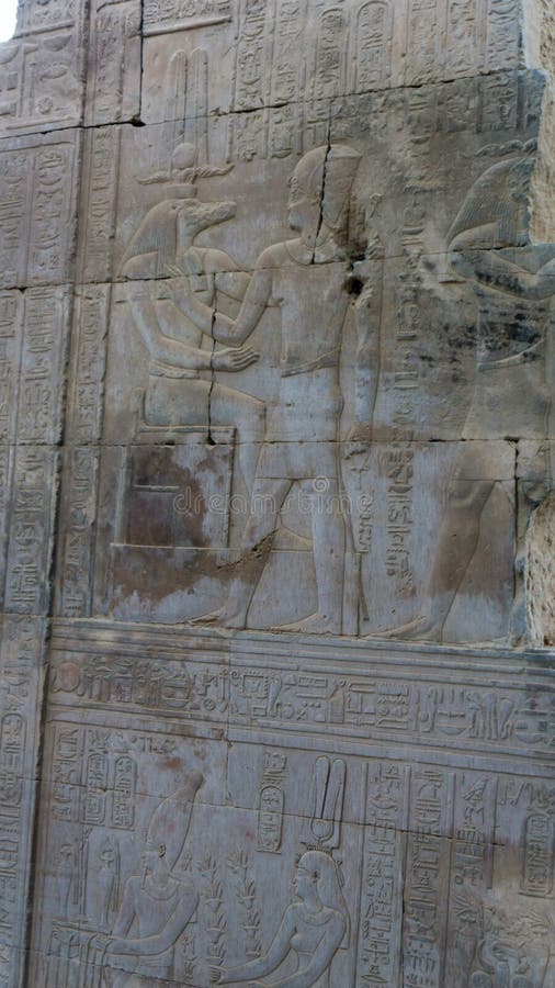Egyptian Ancient Temple Engravings on Stock Photo - Image of relief ...