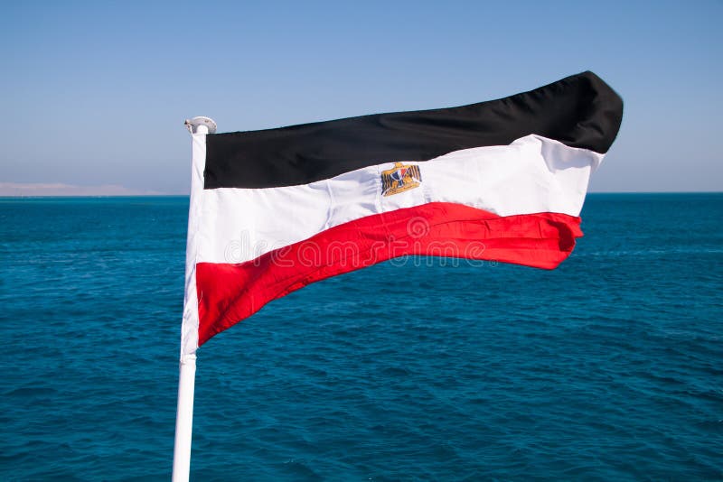 Egyptian Flag Floating in the Sun with Red Sea in the Background Stock ...